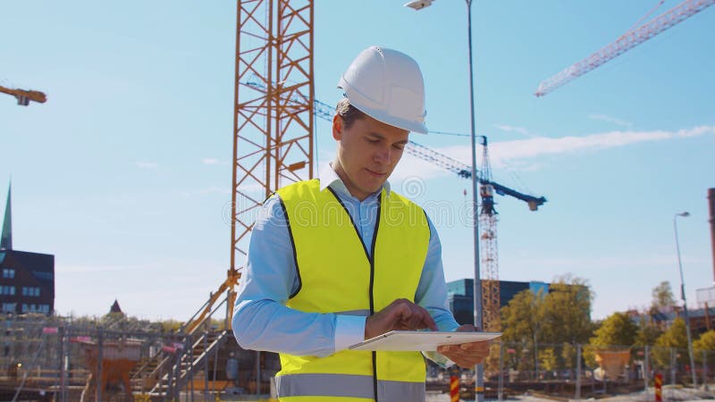 Professional Builder Standing in Front of Construction Site. Foreman in ...