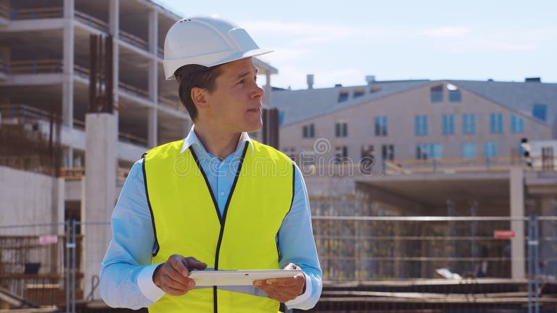 Professional Builder Standing in Front of Construction Site. Foreman in ...