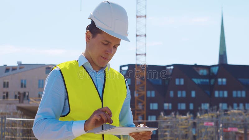 Professional Builder Standing in Front of Construction Site. Foreman in ...