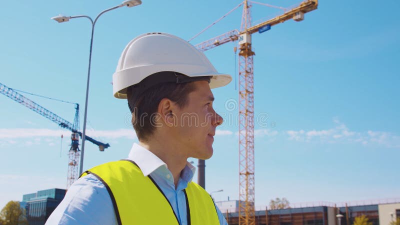 Professional Builder Standing in Front of Construction Site. Foreman in ...