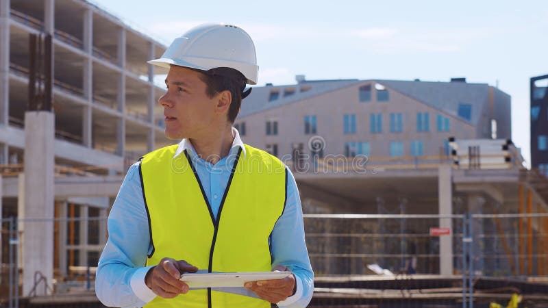 Professional Builder Standing in Front of Construction Site. Foreman in ...