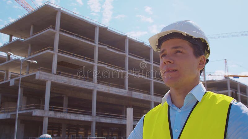Professional Builder Standing in Front of Construction Site. Foreman in ...