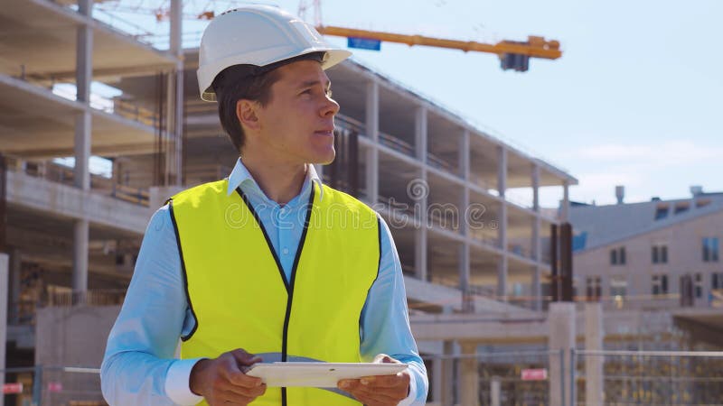 Professional Builder Standing in Front of Construction Site. Foreman in ...