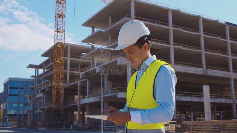 Professional Builder Standing in Front of Construction Site. Foreman in ...