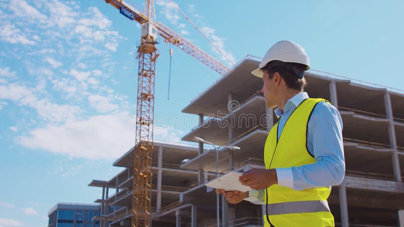 Professional Builder Standing in Front of Construction Site. Foreman in ...