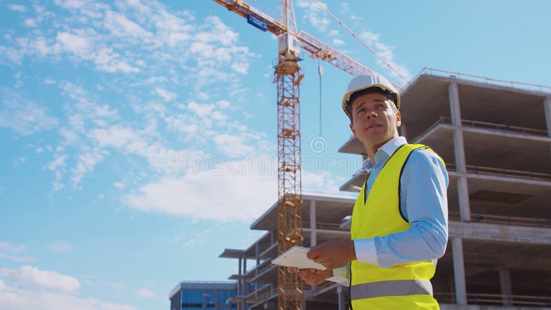 Professional Builder Standing in Front of Construction Site. Foreman in ...