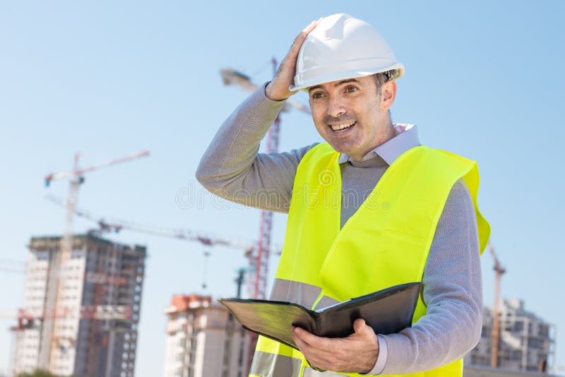 Professional Builder Standing with a Notebook Stock Photo - Image of ...