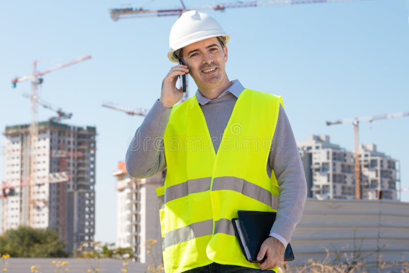 Professional Builder Standing Talking on a Phone Stock Photo - Image of ...