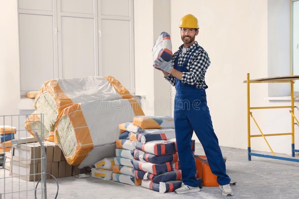 Professional Builder in Uniform with Bag of Cement Stock Photo - Image ...