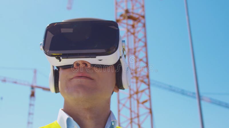 Professional Builder in VR Helmet Standing in Front of Construction ...