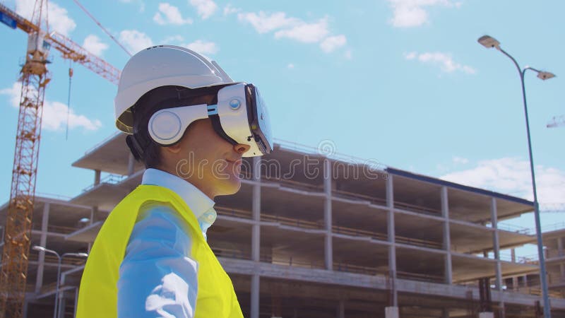 Professional Builder in VR Helmet Standing in Front of Construction ...