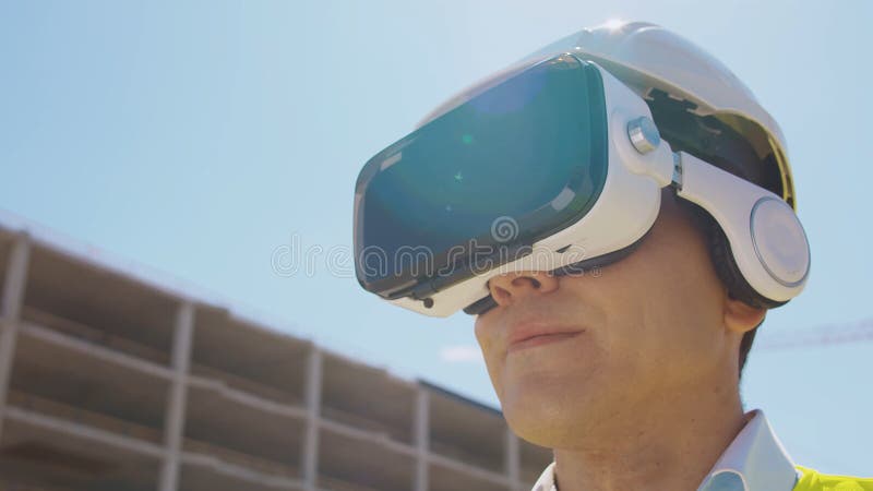 Professional Builder in VR Helmet Standing in Front of Construction ...