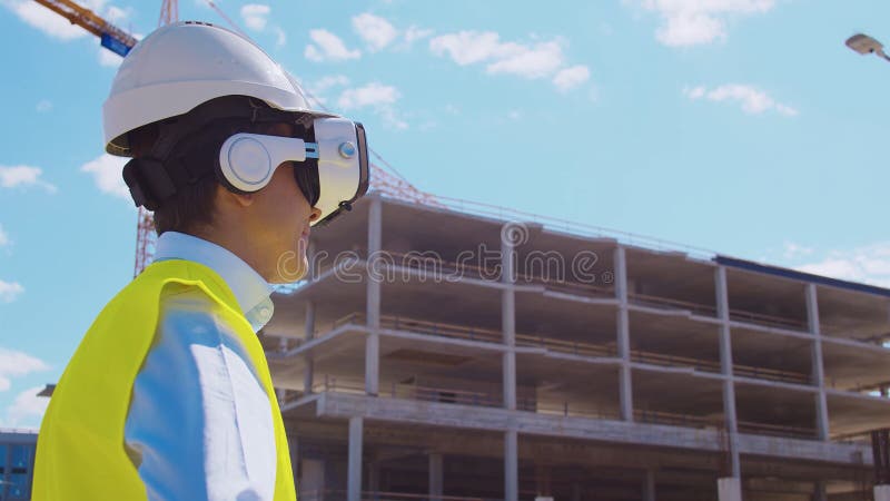 Professional Builder in VR Helmet Standing in Front of Construction ...