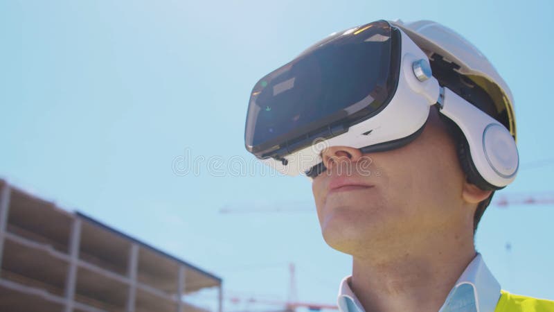 Professional Builder in VR Helmet Standing in Front of Construction ...