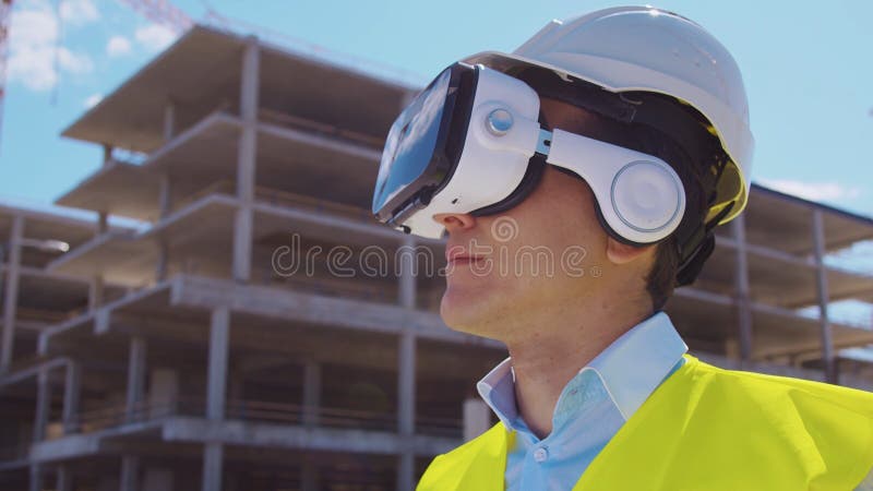 Professional Builder in VR Helmet Standing in Front of Construction ...