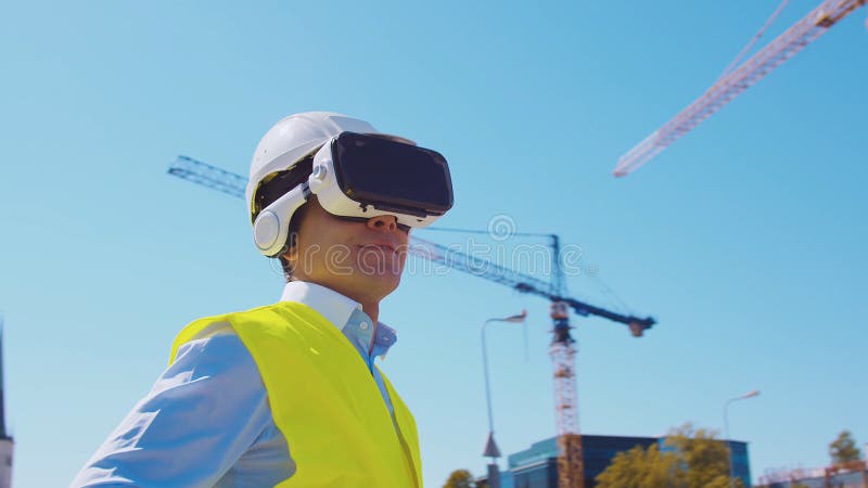 Professional Builder in VR Helmet Standing in Front of Construction ...