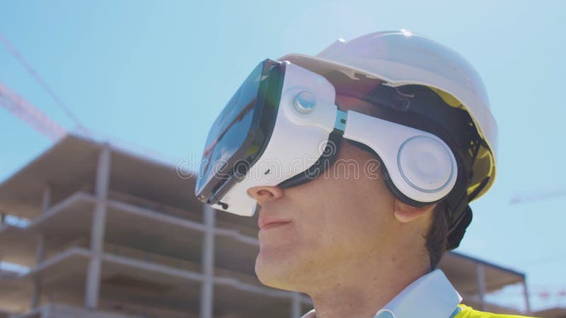 Professional Builder in VR Helmet Standing in Front of Construction ...