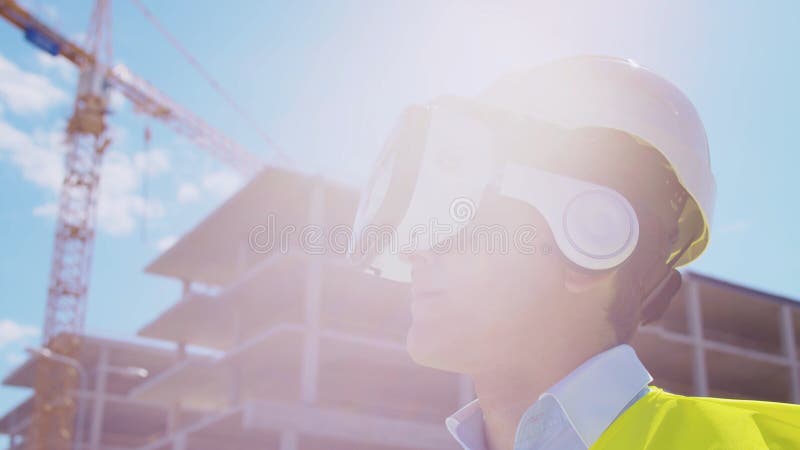 Professional Builder in VR Helmet Standing in Front of Construction ...