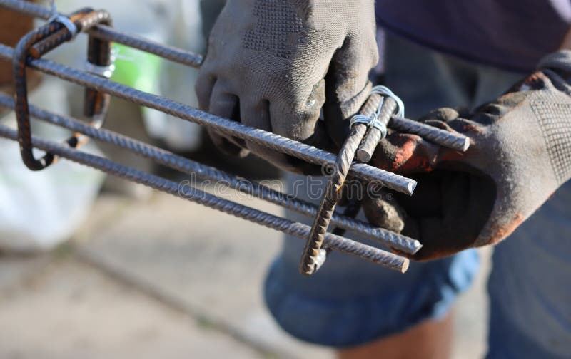 Hand Holding Reinforcement Steel. Professional Construction Worker ...