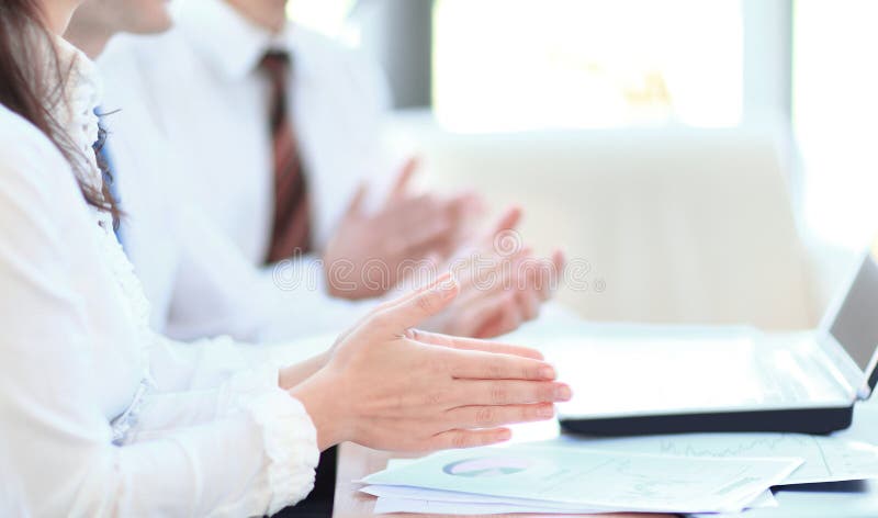 Closeup. Professional Business Team Applauding the Speaker Stock Photo ... Closeup. Professional Business Team Applauding the Speaker Stock Photo ...