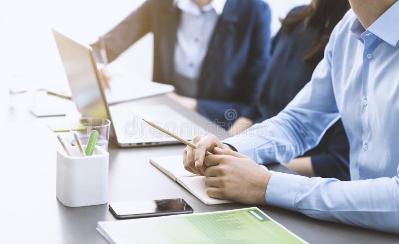 Professional Business Team Working Together at Desk Stock Photo - Image ...
