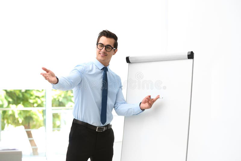 Professional Trainer Near Flip Chart in Office Stock Image - Image of ...