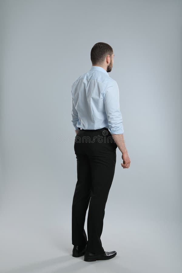 Professional Businessman on Grey Background, Back View Stock Image ...