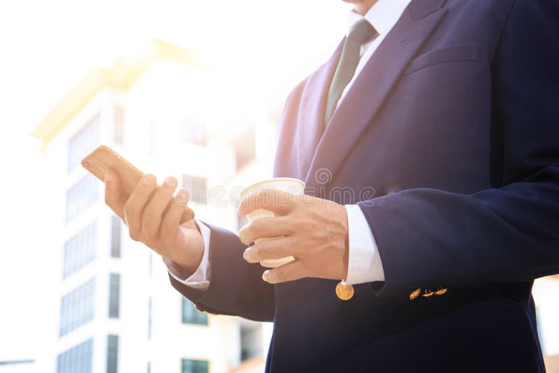 Professional Businessman Using Mobile or Smartphone and Holding Stock ...