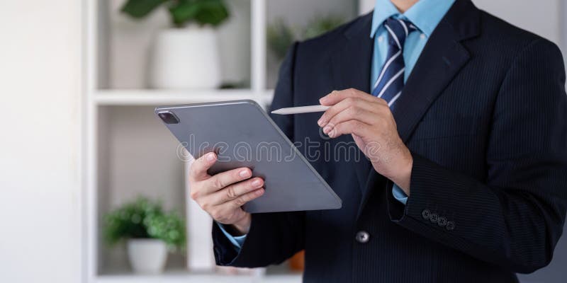 Professional Businessman Using Tablet for Digital Presentations in ...