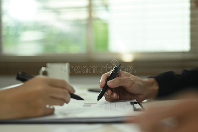 Professional Businesspeople Discussing and Working with Financial Graph ...