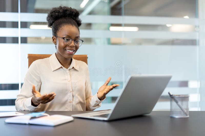 Businesswoman Engaging in Virtual Meeting on Video Call with Laptop in ...