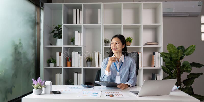 Professional Businesswoman in Modern Office Setting with Technology and ...