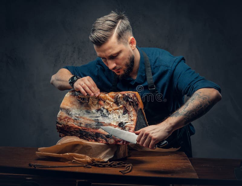 Professional Butcher is Cutting Raw Smoked Meat on a Table for C Stock ...