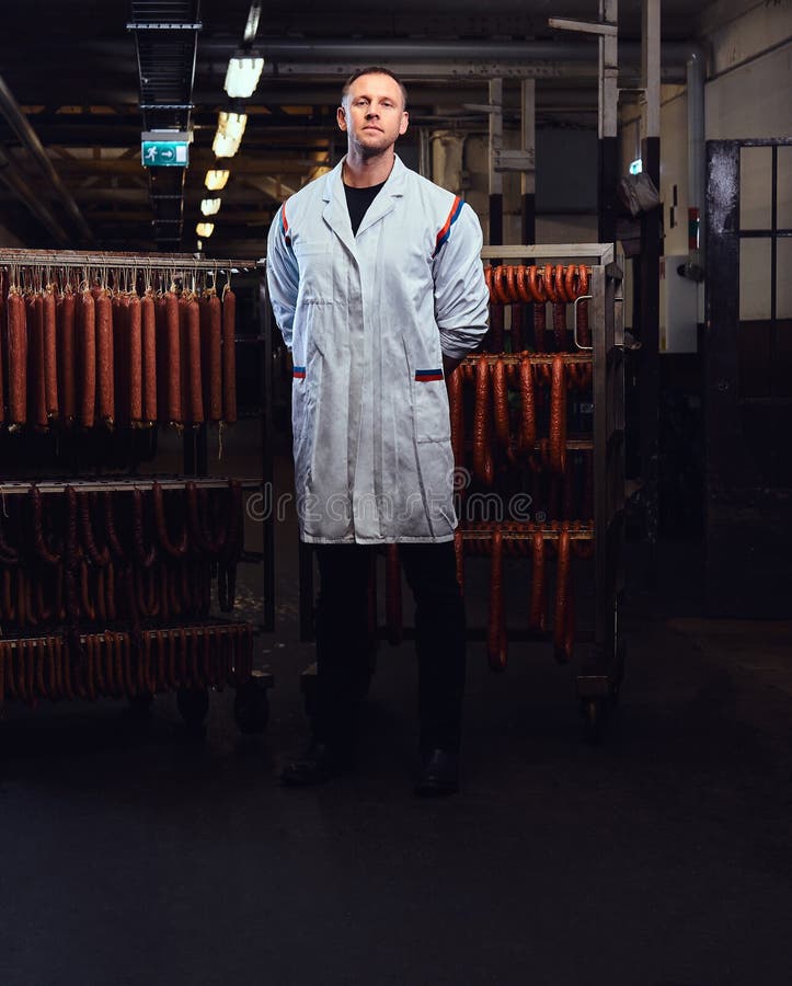 Professional Butcher Standing in the Storage Room. Stock Photo - Image ...