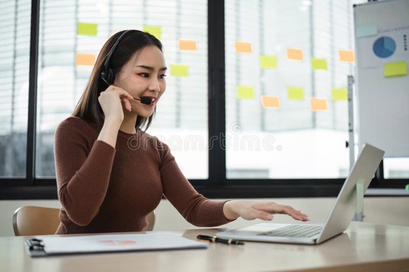 Professional Call Center Woman Using Headset and Laptop in Modern ...