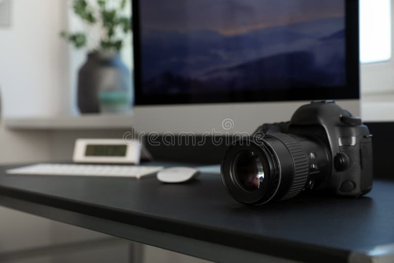 Professional Camera and Computer on Table in Photo Studio, Space for ...