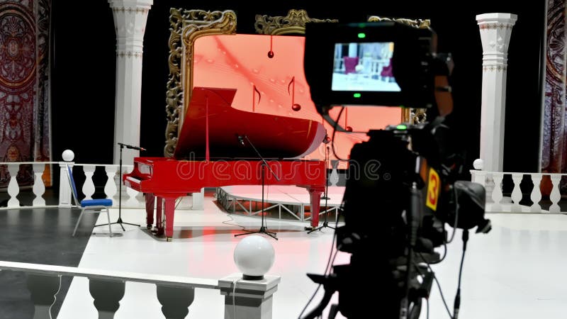 Professional Camera Filming a Red Piano on the Bac Stock Video - Video ...