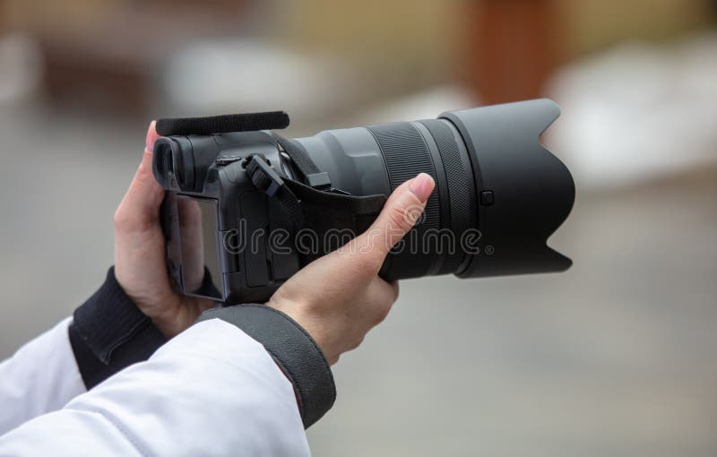 Professional Camera in the Hands of a Girl. Close-up. Stock Photo ...