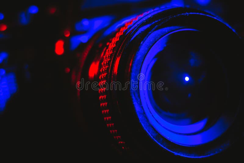 Professional Camera and Lens Illuminated in Red and Blue Stock Image ...
