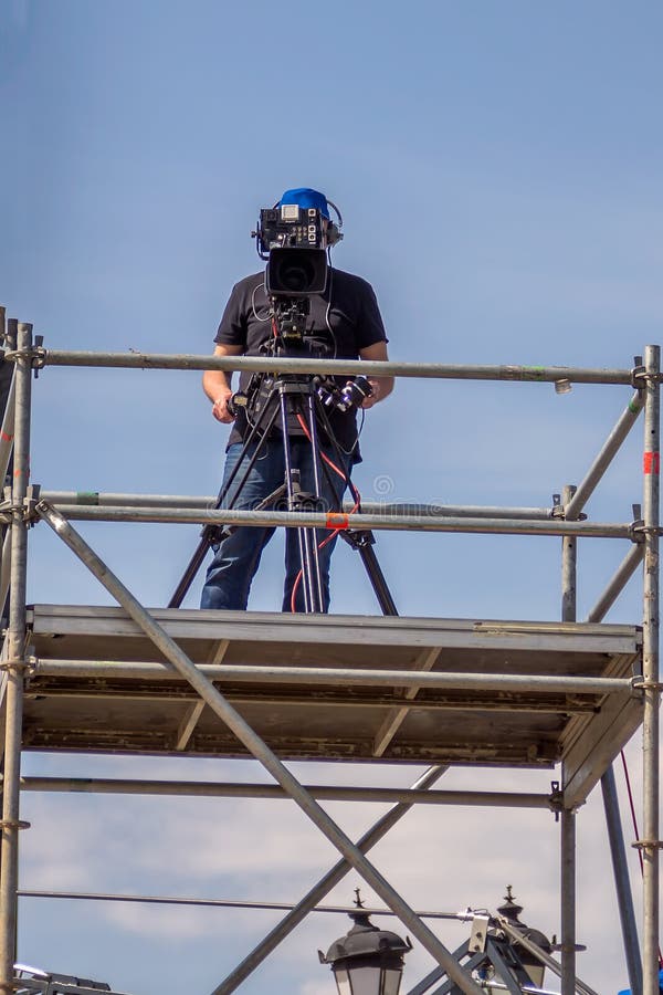 Cameraman With Professional Recording Equipment Doing Live Interview Or ...