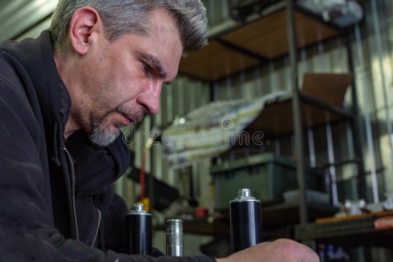 Professional Car Mechanic Working in Auto Repair Service. Stock Photo ...