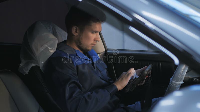 Professional Car Mechanic Working in Modern Auto Repair Service and ...