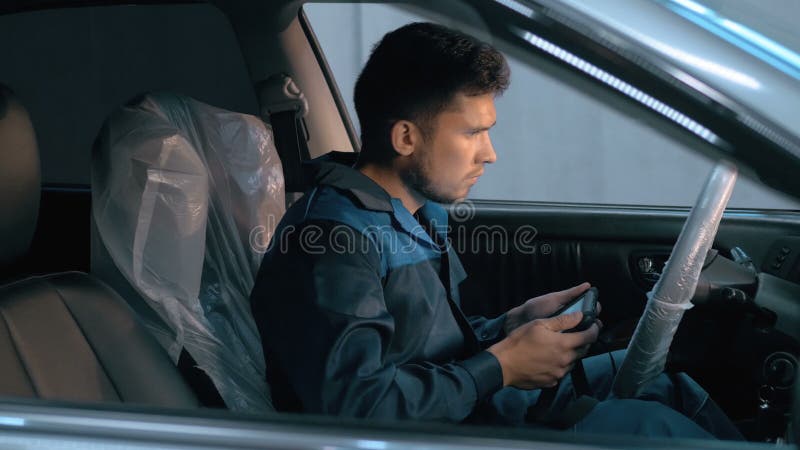 Professional Car Mechanic Working in Modern Auto Repair Service and ...