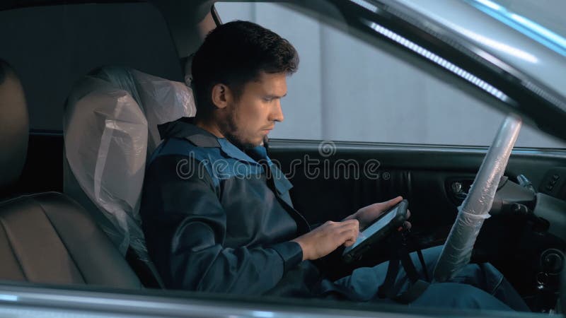 Professional Car Mechanic Working in Modern Auto Repair Service and ...