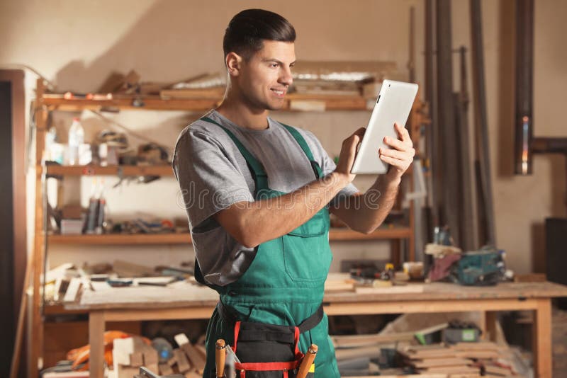 Professional Carpenter with Tablet in Workshop Stock Image - Image of ...