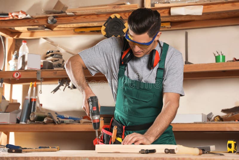 Professional Carpenter Twisting with Drill Stock Image - Image of ...