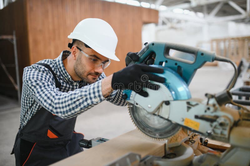 Professional Carpenter Using Sawing Machine for Cutting Wooden Board at ...