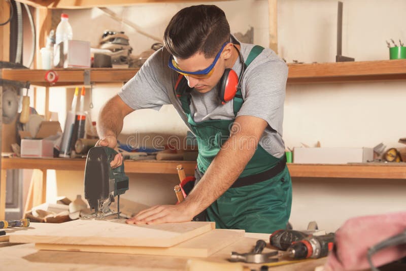 Professional Carpenter Working with Jigsaw Stock Photo - Image of maker ...