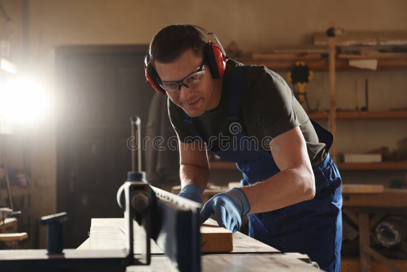 Professional Carpenter Working with Wood in Shop Stock Photo - Image of ...