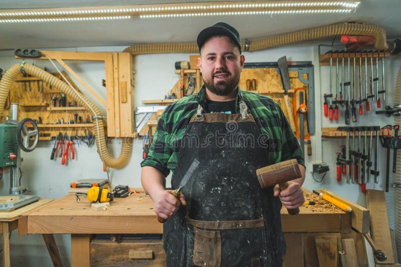 Professional Carpenter Workshop. Adult Man in Protective Apron Holding ...